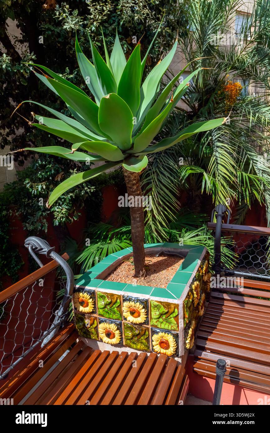 Casa Vicens. Planter with flower tiles and sunflower leaves The ...
