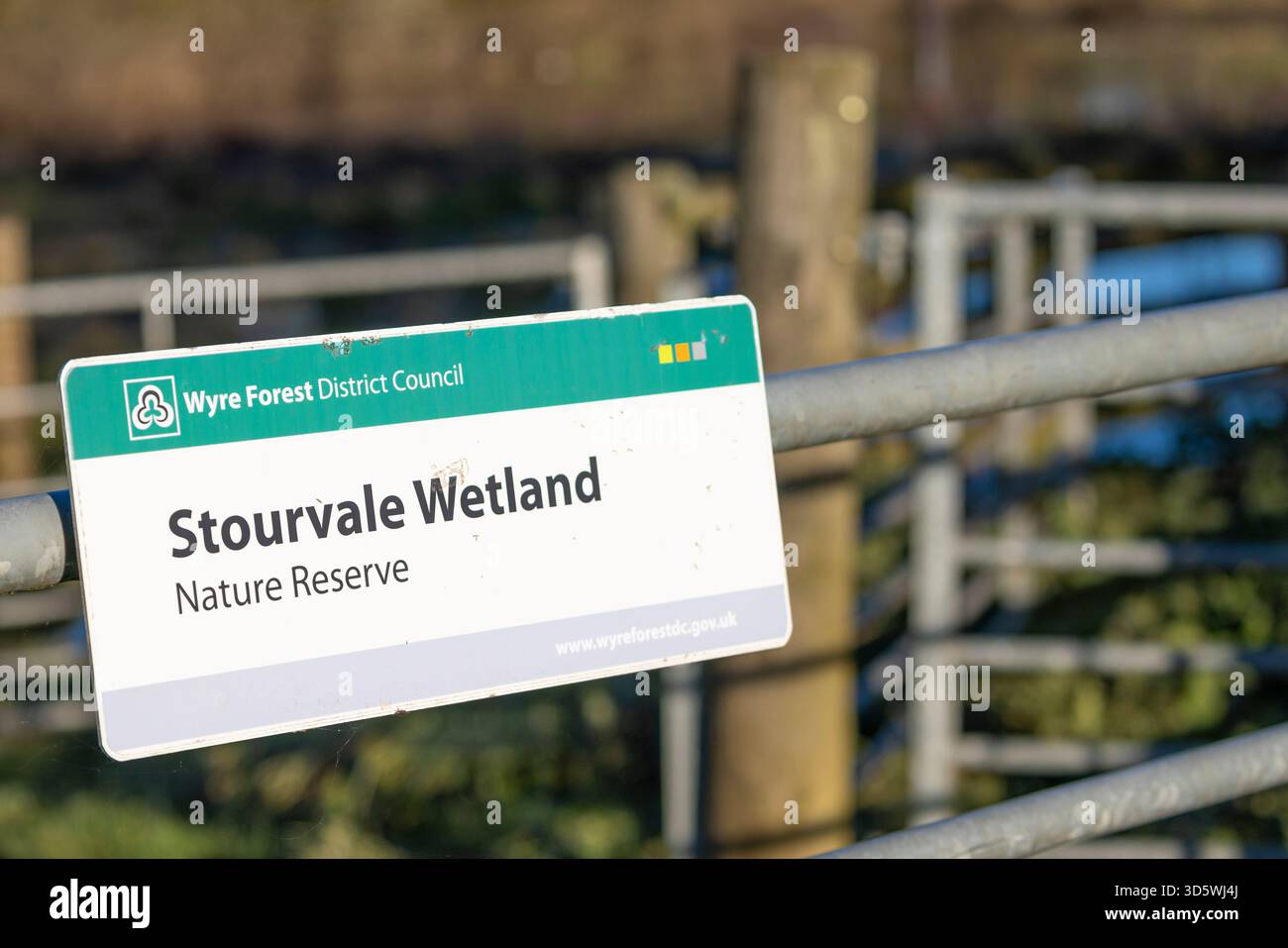 Close up view of a Stourvale Wetland nature reserve sign mounted on a ...