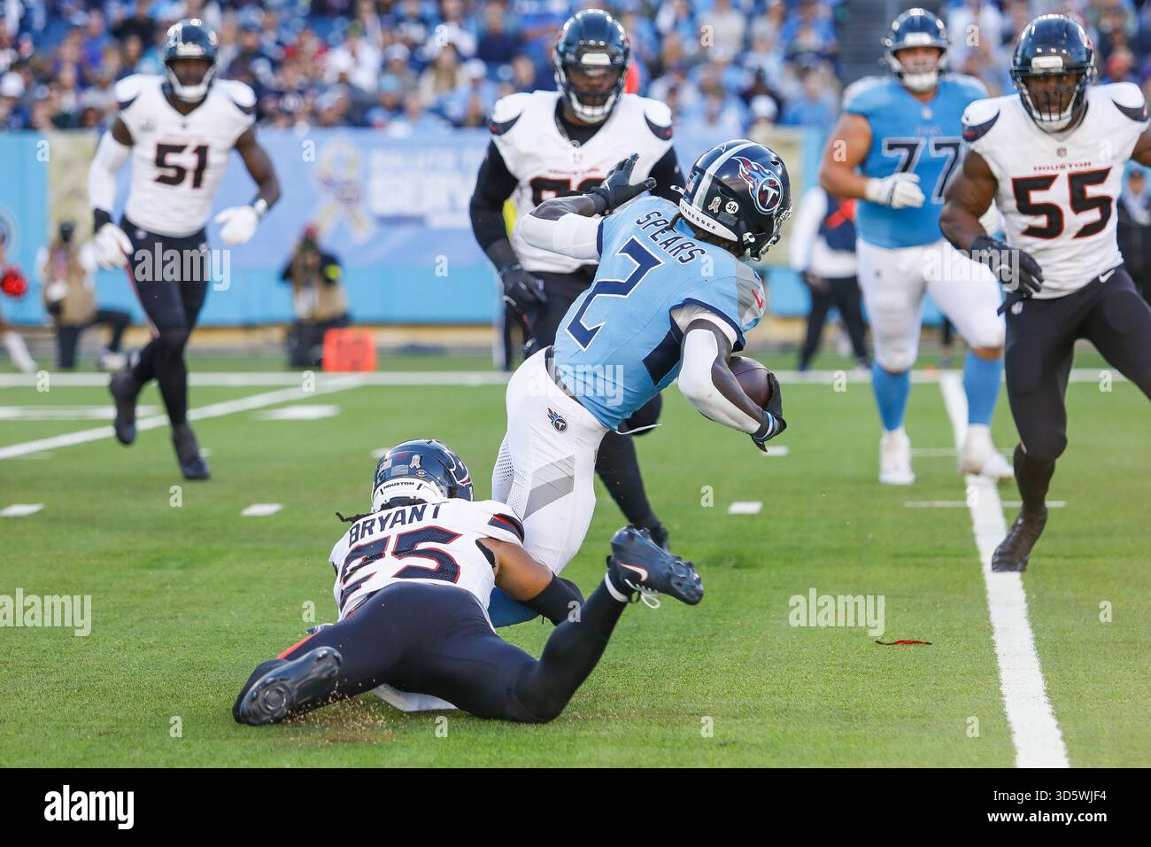 Tennessee Titans running back Tyjae Spears (2) is tackled by Houston ...