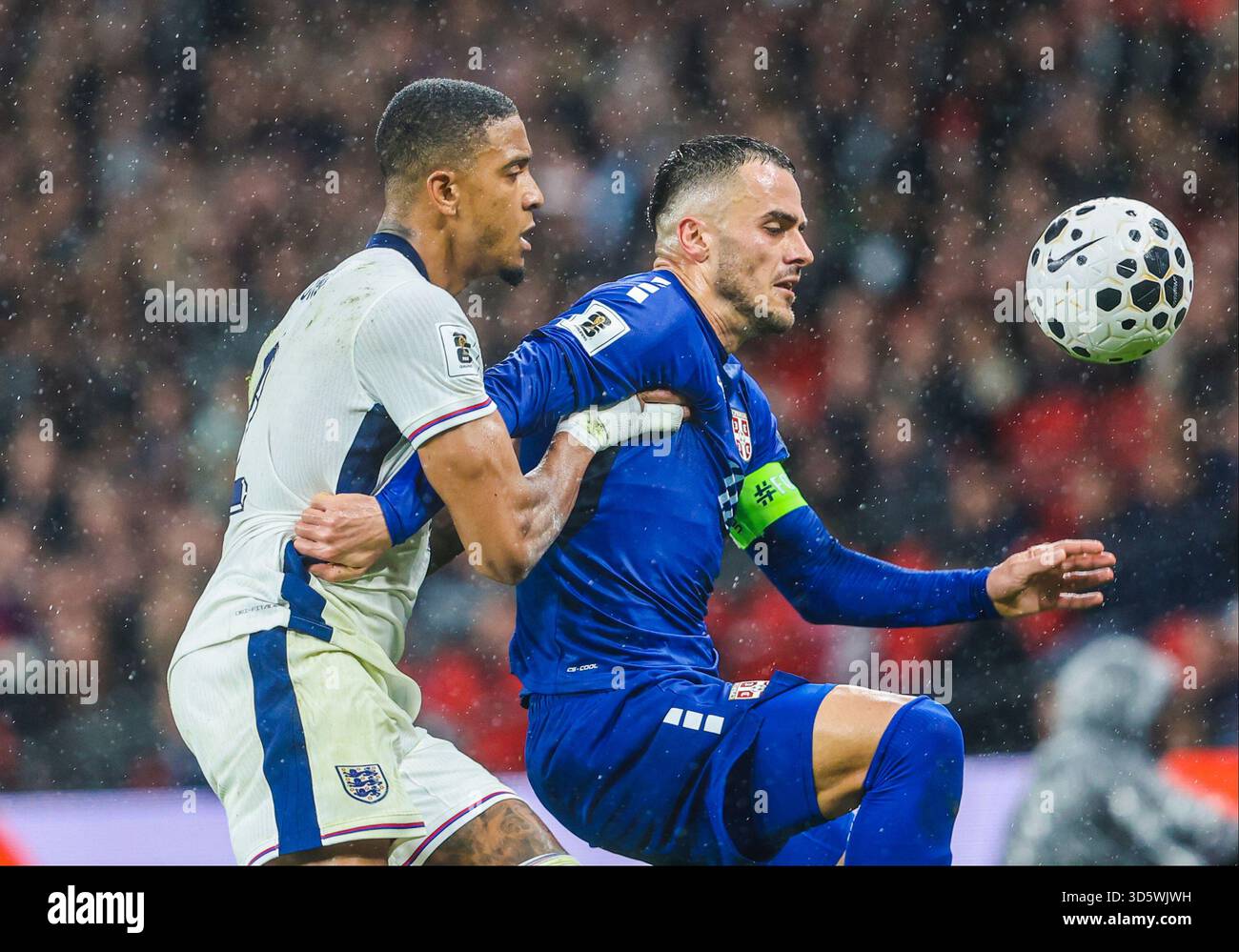 London, UK. 13th Nov, 2025. England's Ezri Konsa and Serbia's Filip ...