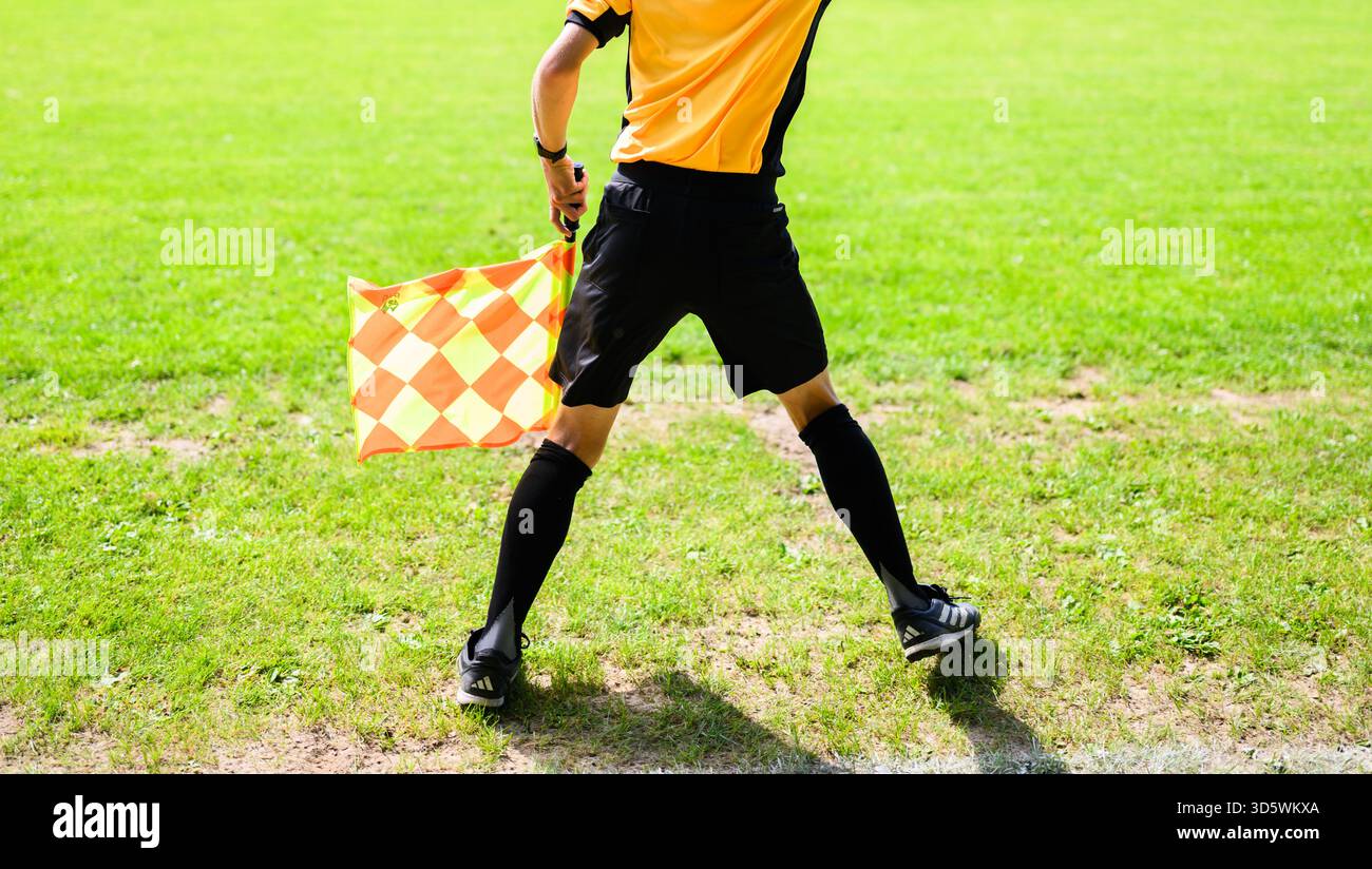 PRODUCTION - 10 August 2025, Lower Saxony, Hanover: A young referee ...