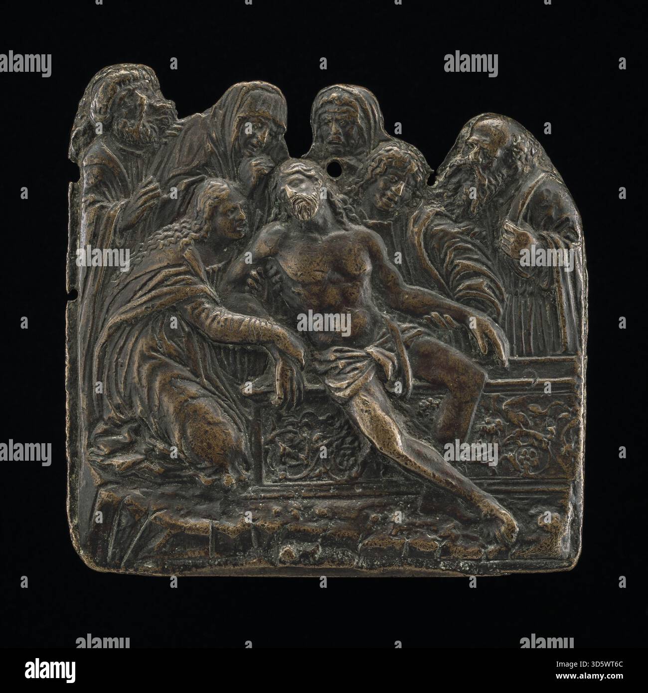 A depiction of the Entombment showing Christ placed in a tomb with the ...