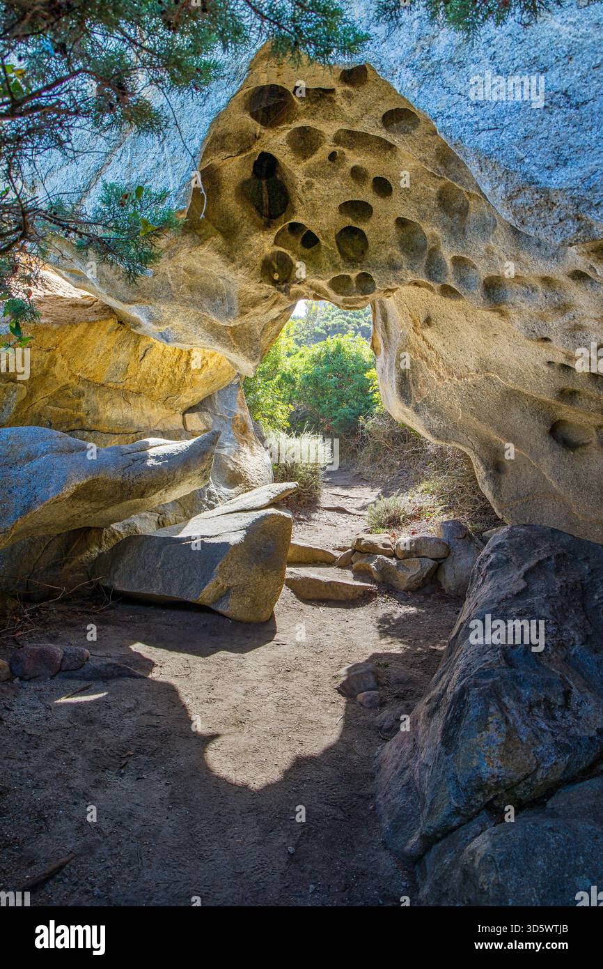 the bizarre granite weathering formations called tafoni on a tunnel ...