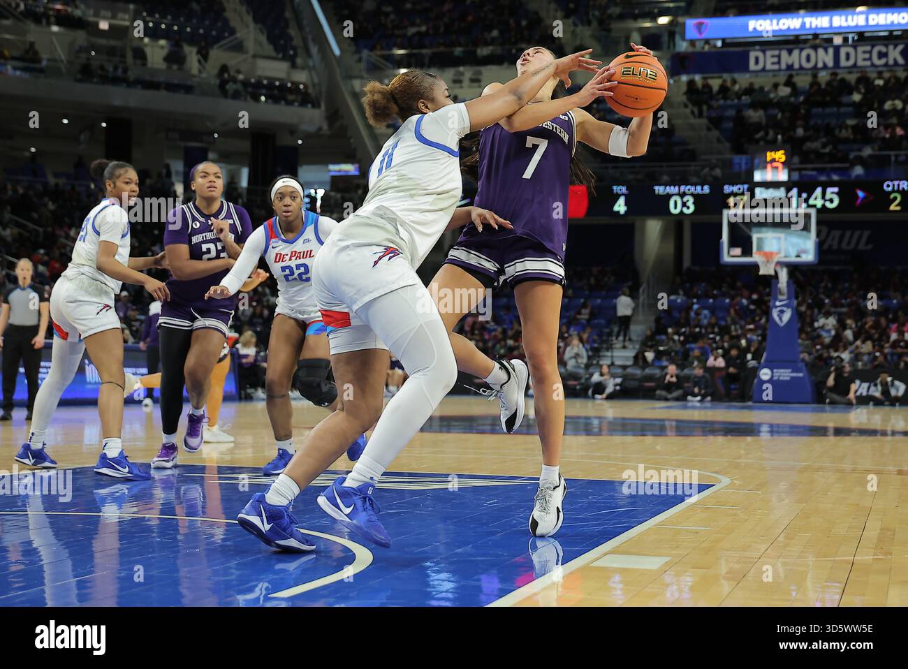 DePaul guard Sumer Lee (11) guards Northwestern guard Caroline Lau (7 ...
