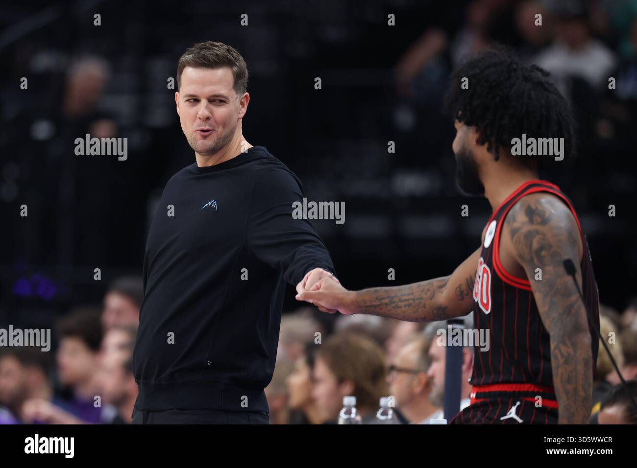 Utah Jazz head coach Will Hardy, left, greets Chicago Bulls guard Coby ...