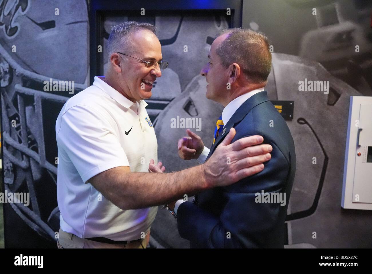 ACC Commissioner Jim Phillips, right, visits with Pittsburgh head coach ...