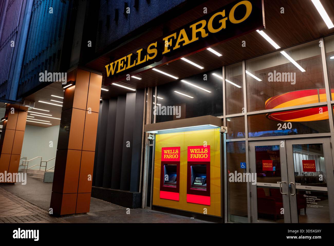 Night view of ATMs under awning with logo for Wells Fargo bank in ...