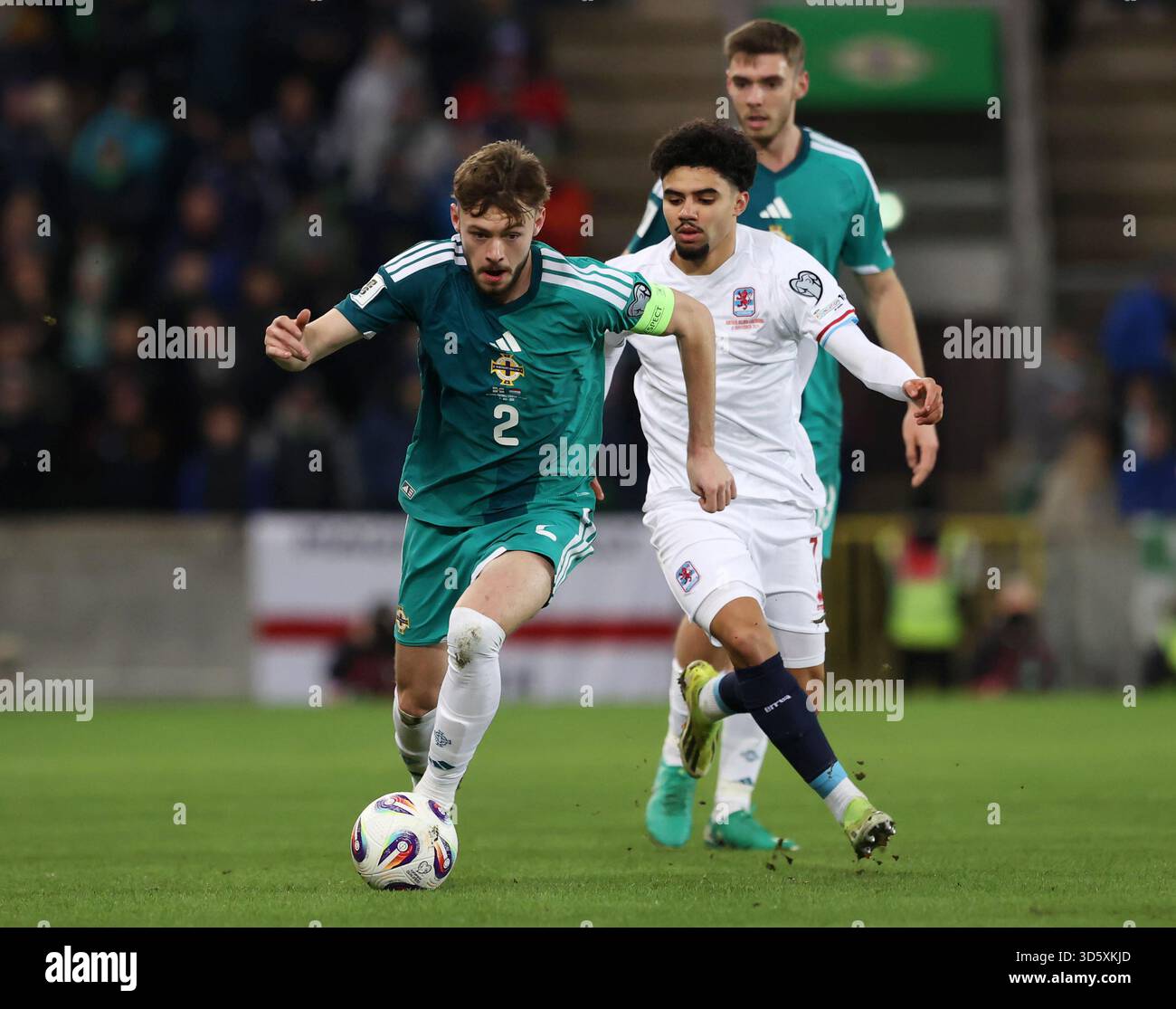 Northern Ireland's Conor Bradley and Luxembourg's Aiman Dardari (right ...