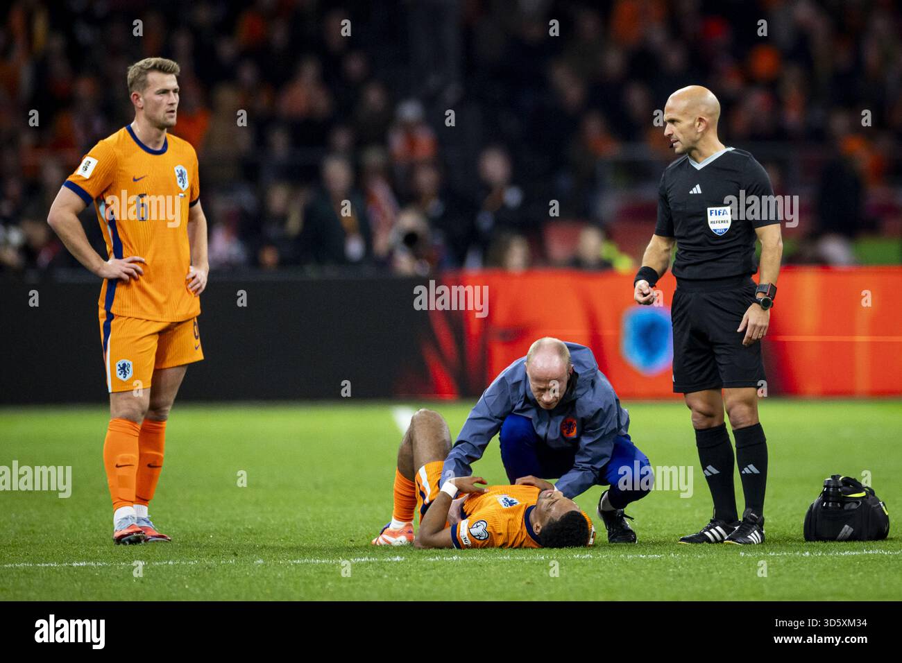 AMSTERDAM - Jurrien Timber of the Netherlands suffers pain during the ...