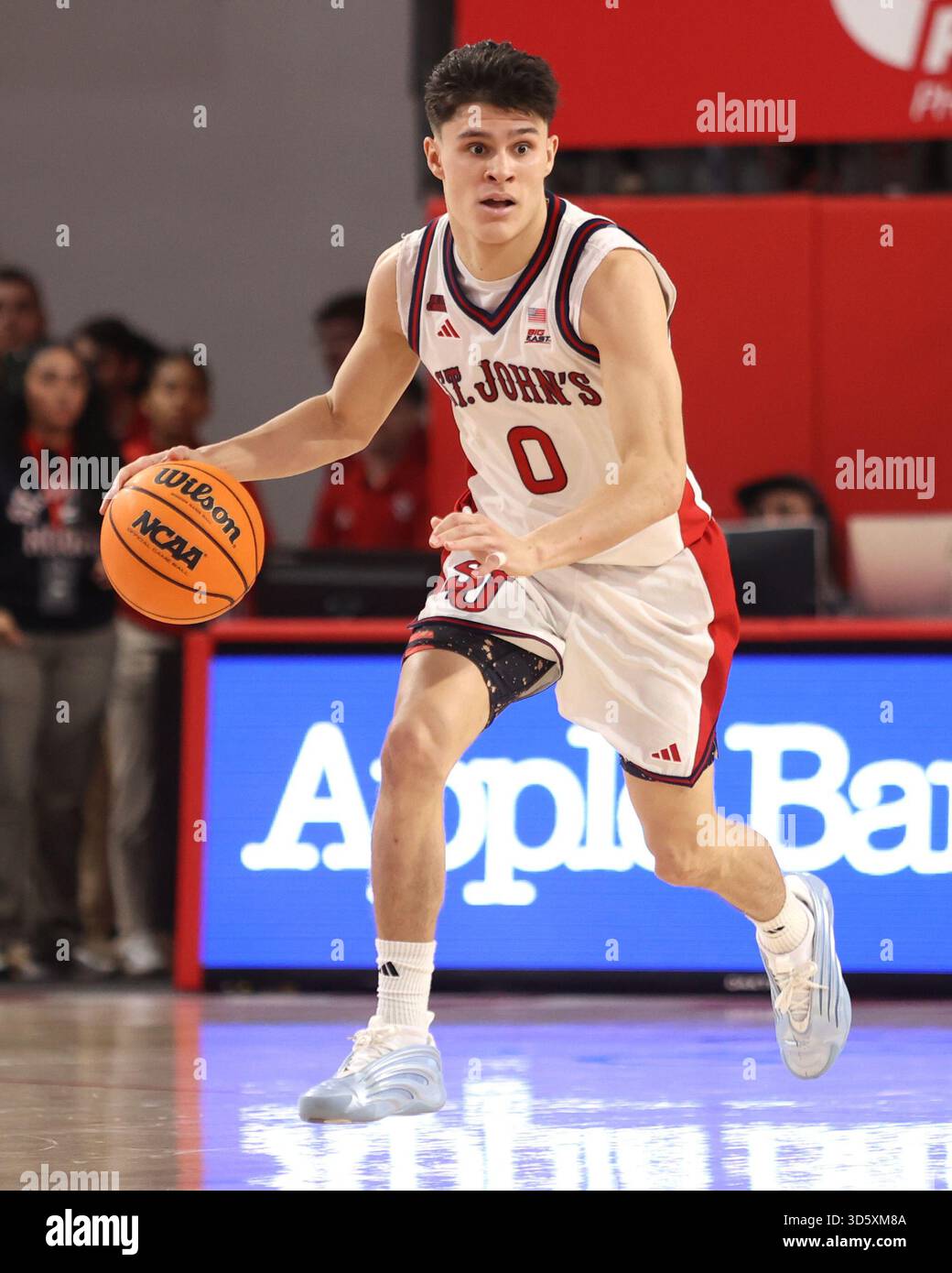 St. John's guard Dylan Darling (0) dribbles the ball during the second ...