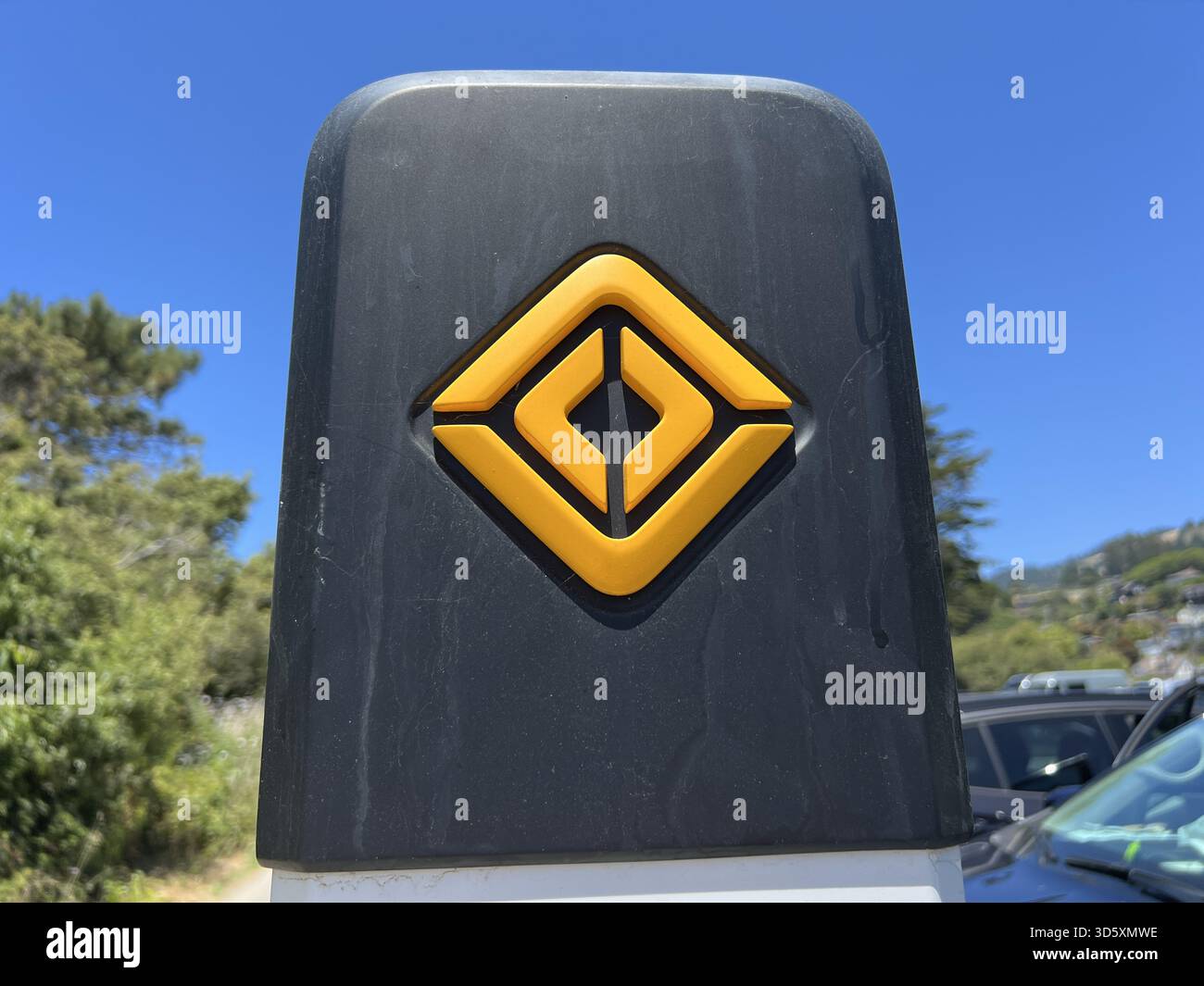 Close-up of a Rivian electric vehicle charging station sign with logo ...
