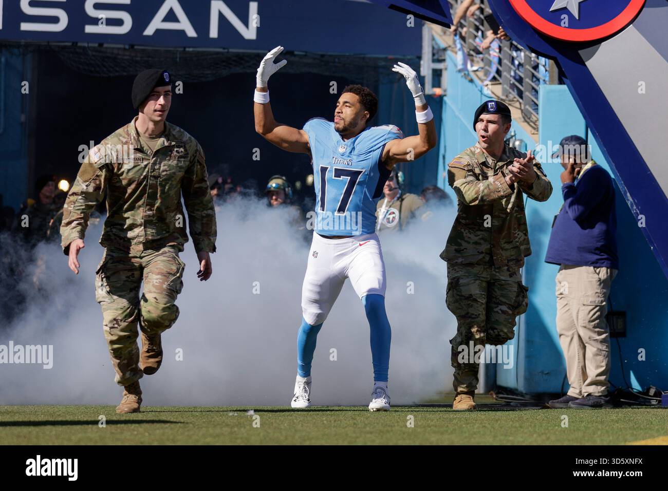 Tennessee Titans wide receiver Chimere Dike (17) is escorted by members ...