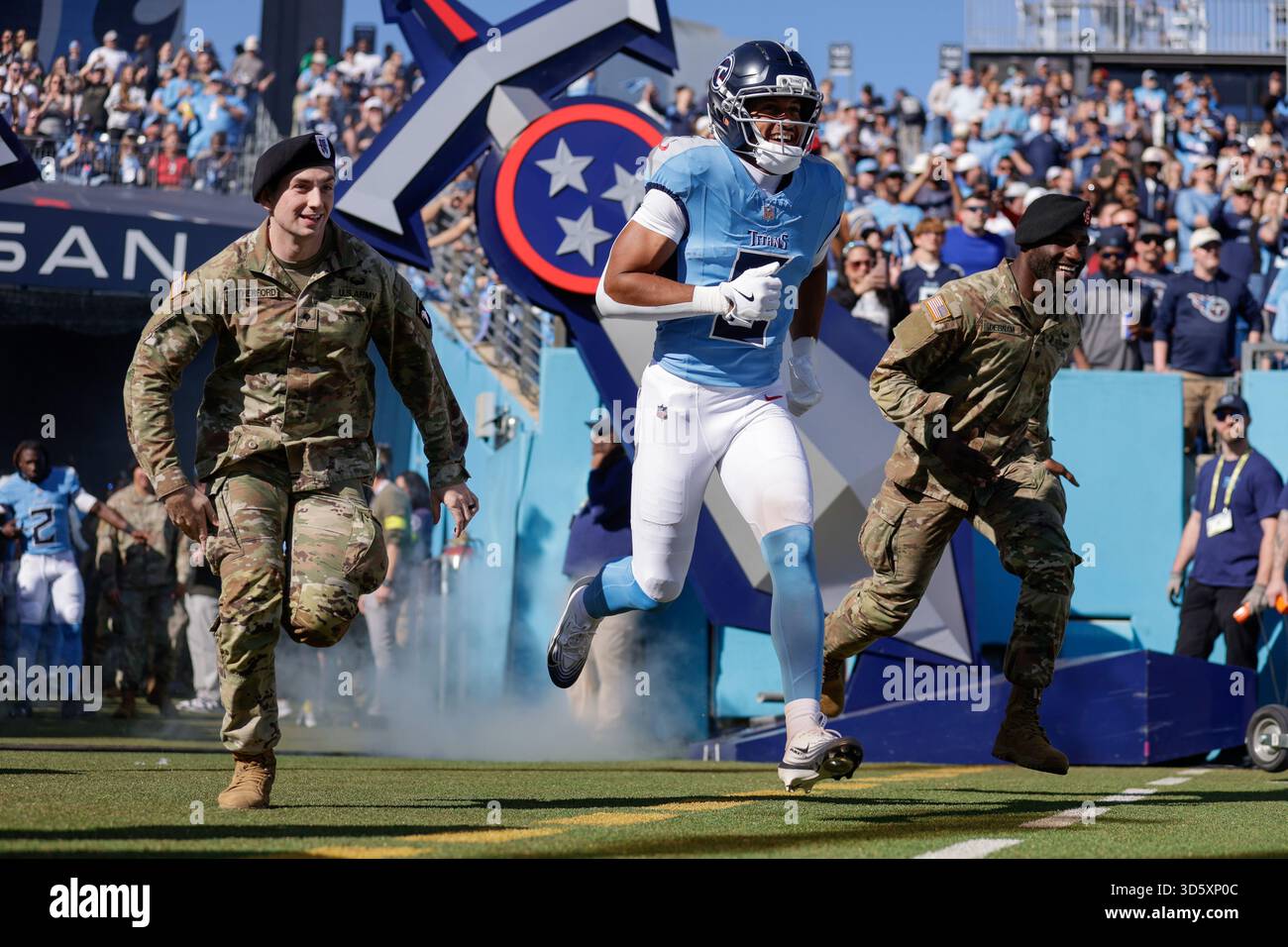 Tennessee Titans wide receiver Elic Ayomanor (5) is escorted by members ...