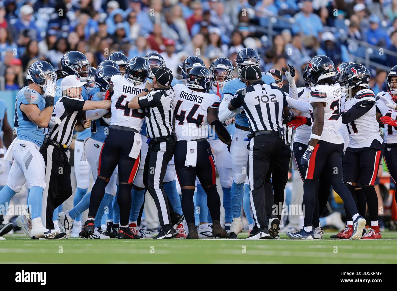 NFL officials break up a fight between the Houston Texans and Tennessee ...
