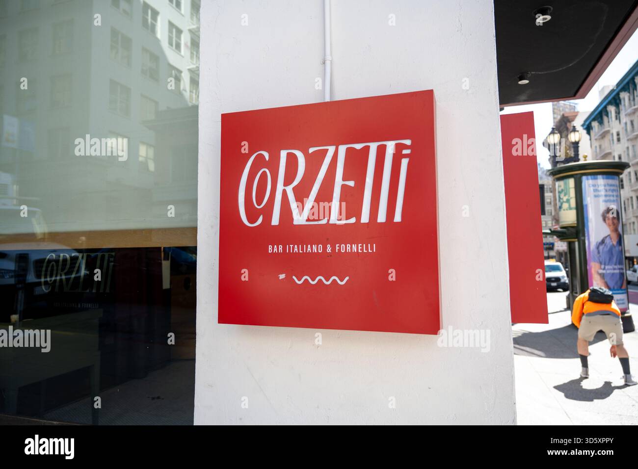 Red Corzetti Bar Italiano sign mounted on white facade along downtown ...