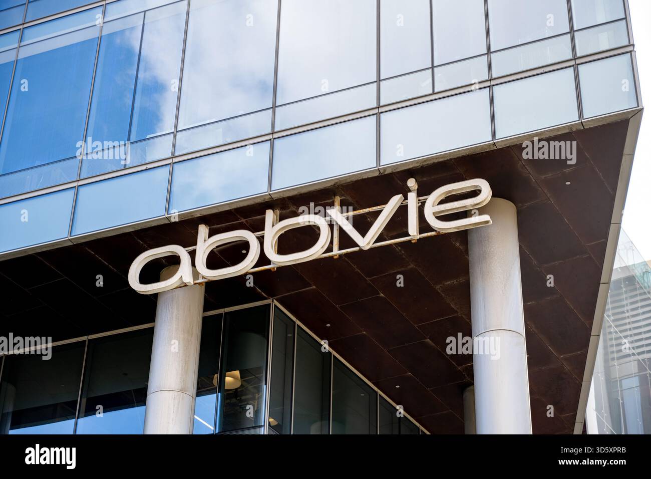 AbbVie logo on modern glass office building with metal columns, South ...