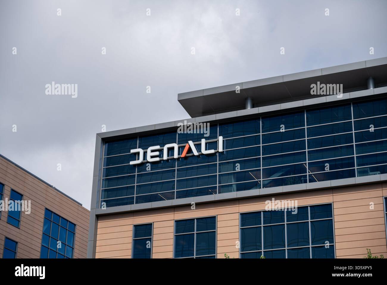Denali logo on modern office building with glass facade on a cloudy day ...