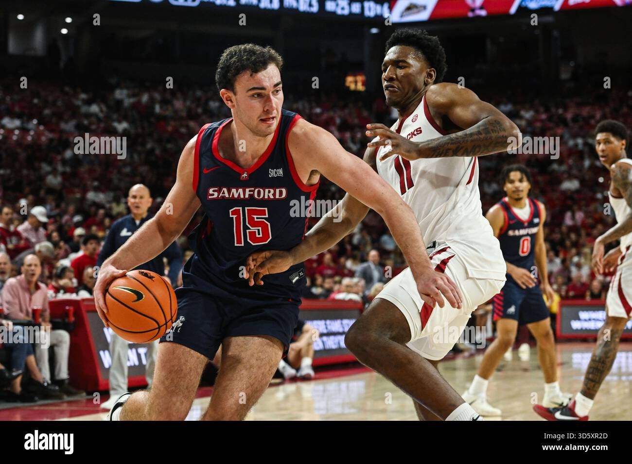 Samford forward Dylan Faulkner (15) tries to drive past Arkansas guard ...