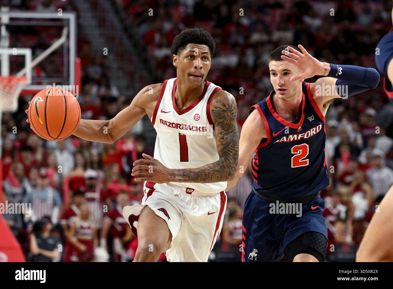 Arkansas guard Meleek Thomas (1) tries to drive past Samford guard ...