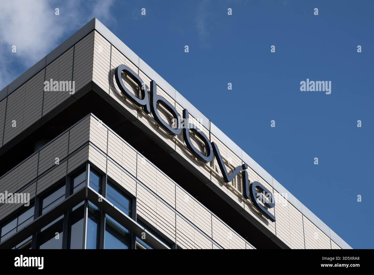 Exterior of modern office building with AbbVie logo under blue sky ...