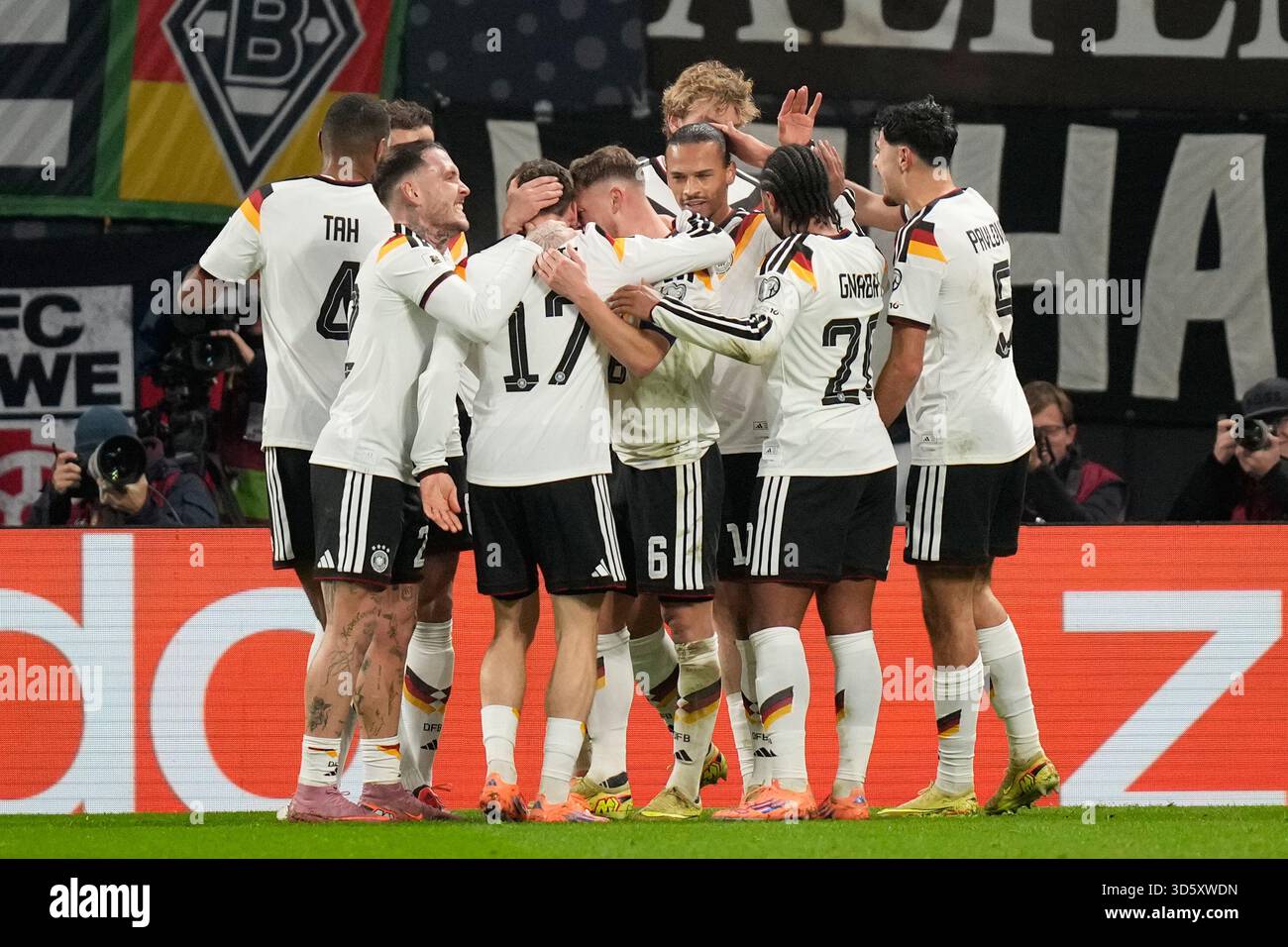 German players celebrate after scoring during a group A World Cup ...