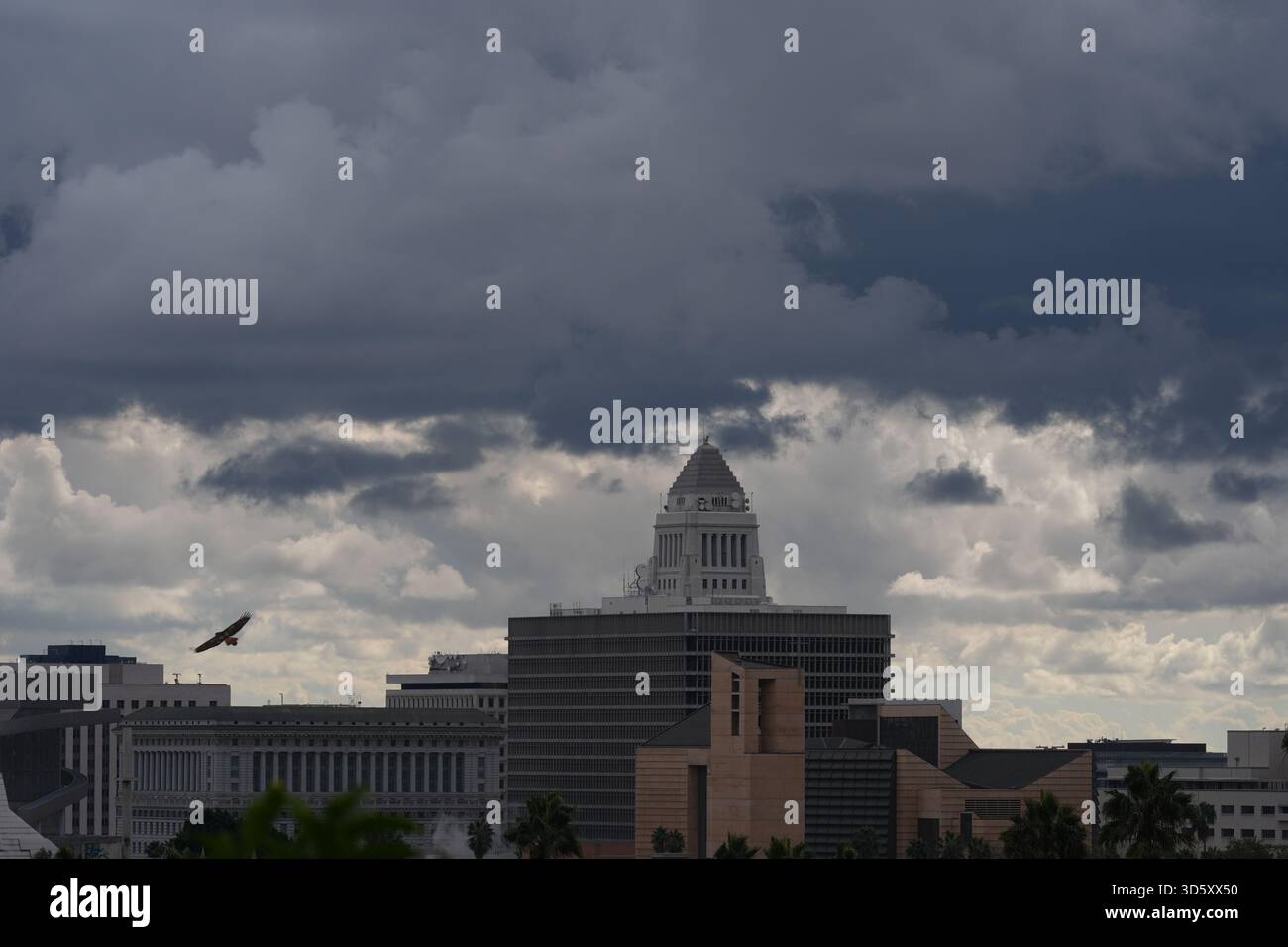 Heavy clouds are seen over the Los Angeles City Hall building, Monday ...