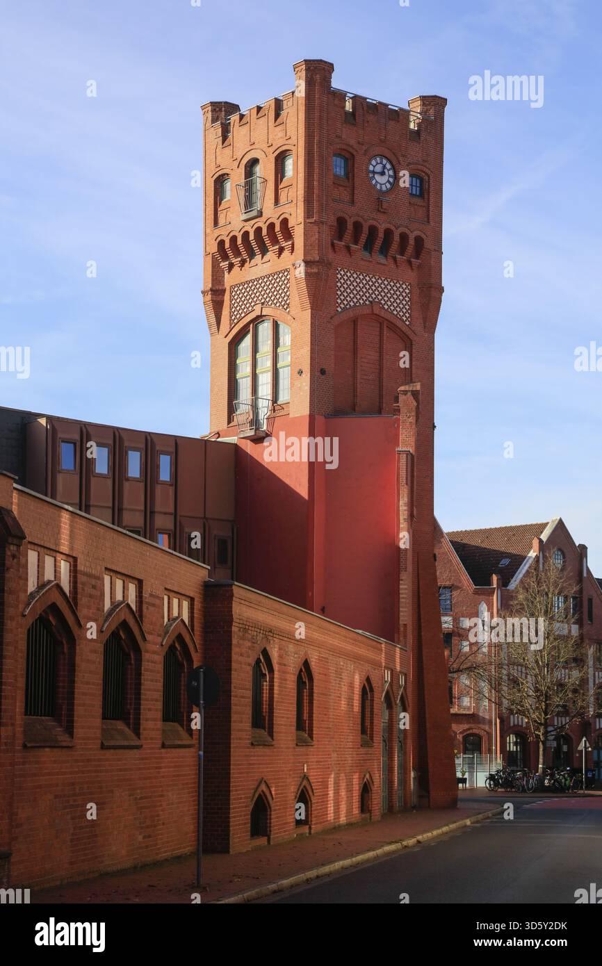 Clock tower in brick of the former Doehrener Wolle wool laundry and ...