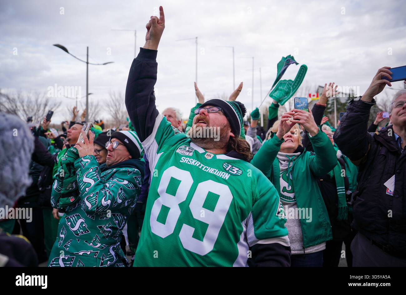 Spectators cheer in front of Mosaic Stadium in Regina, Monday, Nov. 17 ...