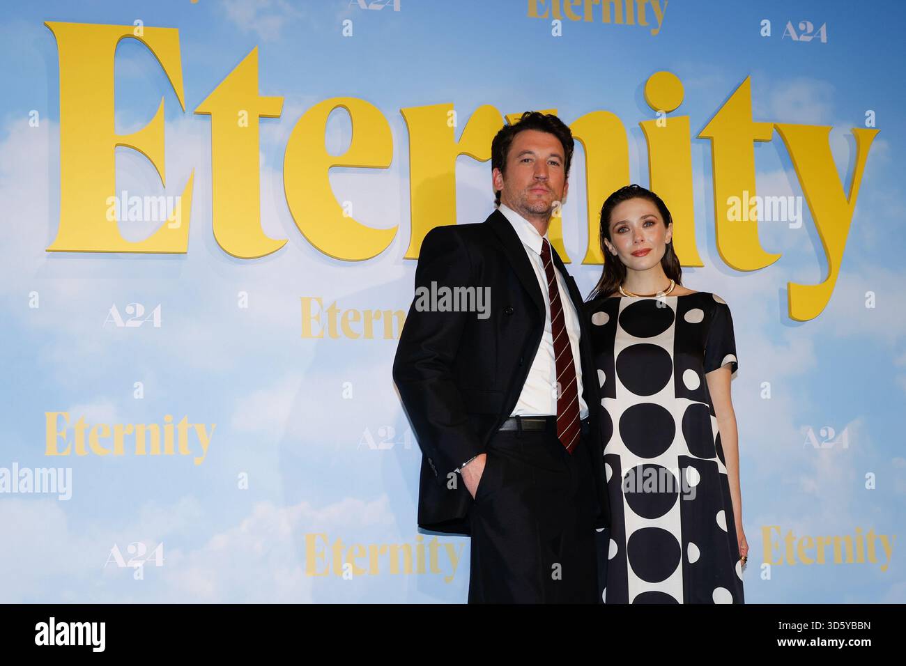 Miles Teller, left, and Elizabeth Olsen pose for photographers upon ...