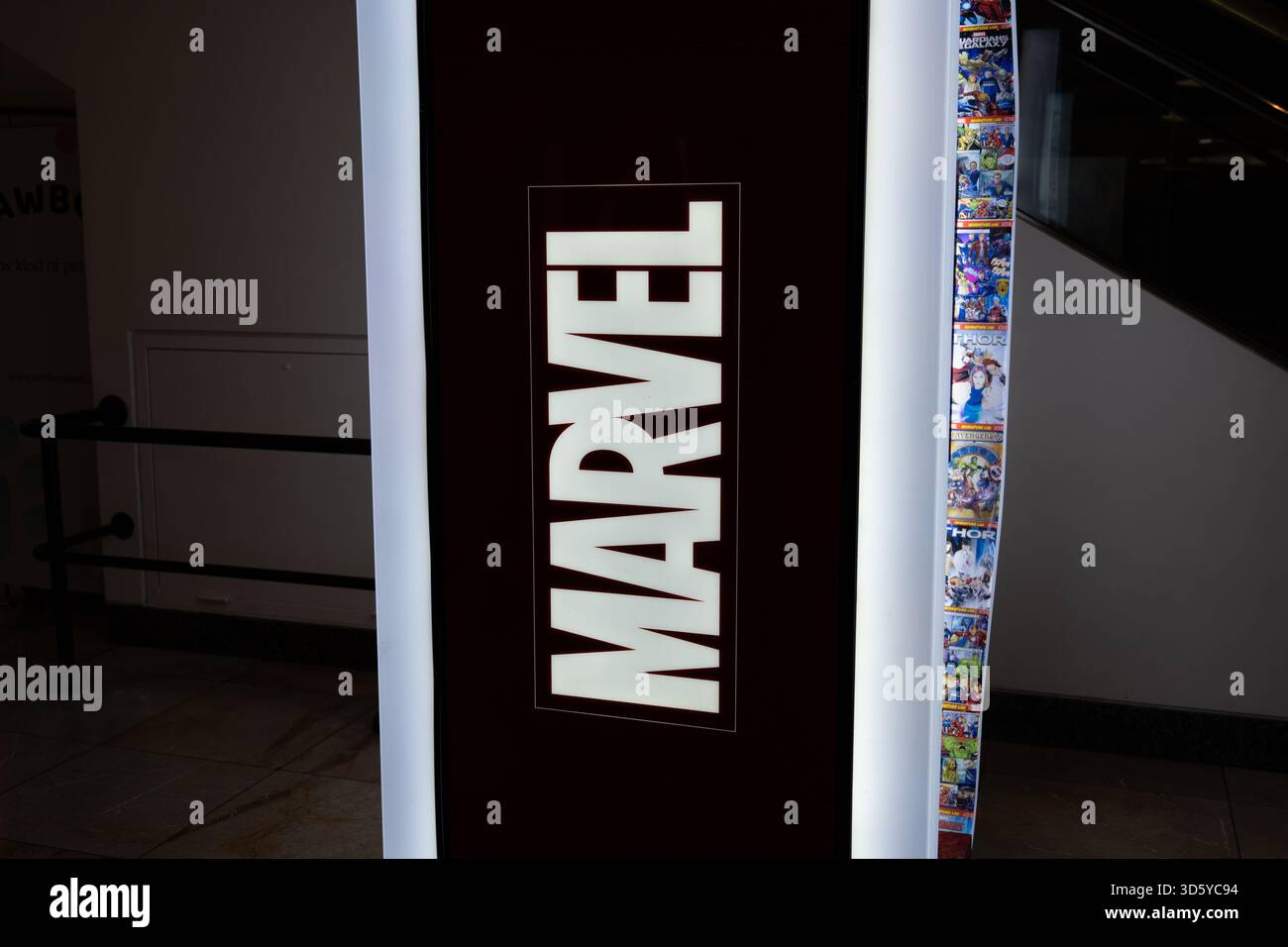 Illuminated Marvel logo on indoor lightbox display with comic book ...