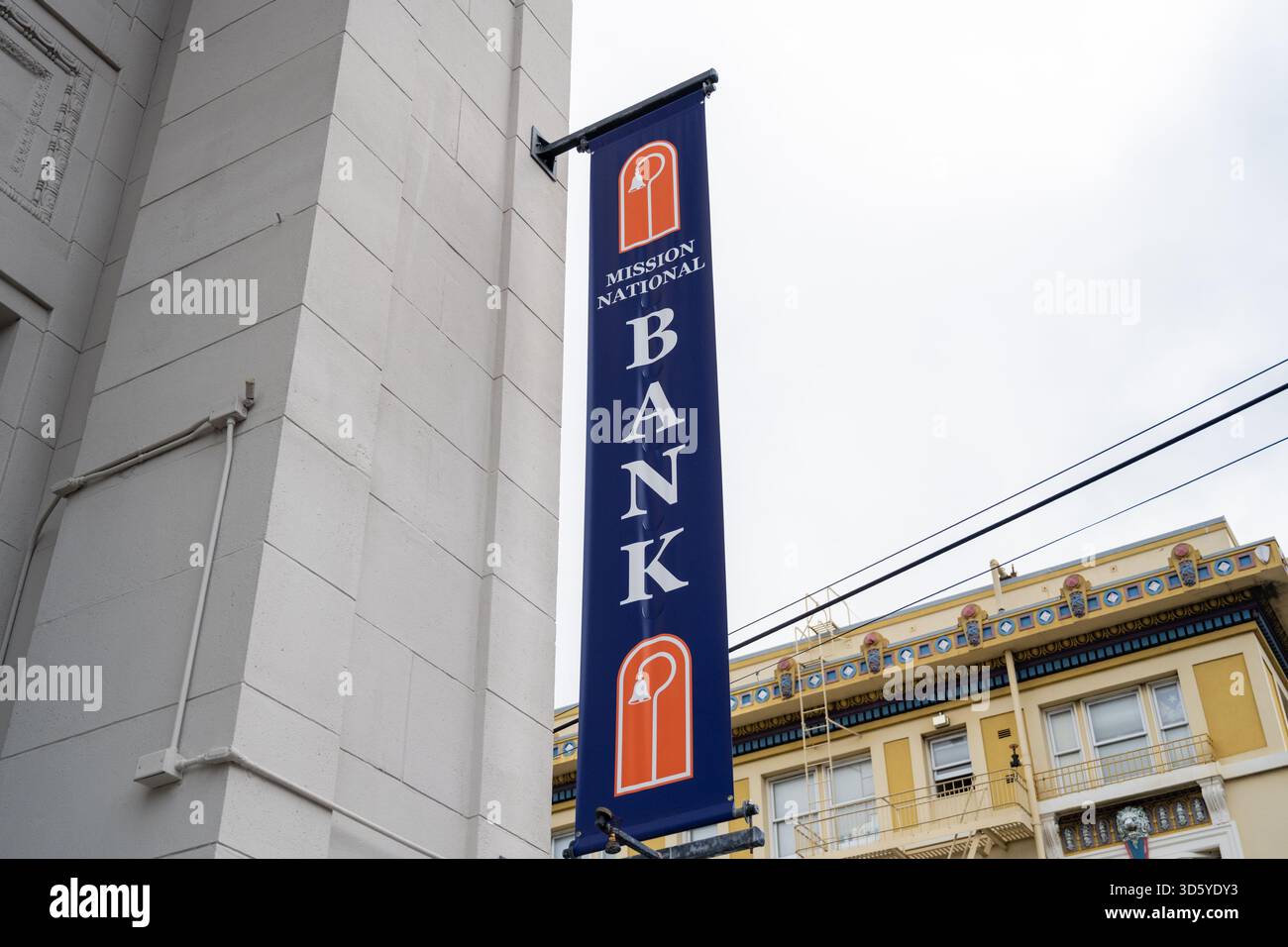 Vertical banner sign for Mission National Bank on exterior of light ...
