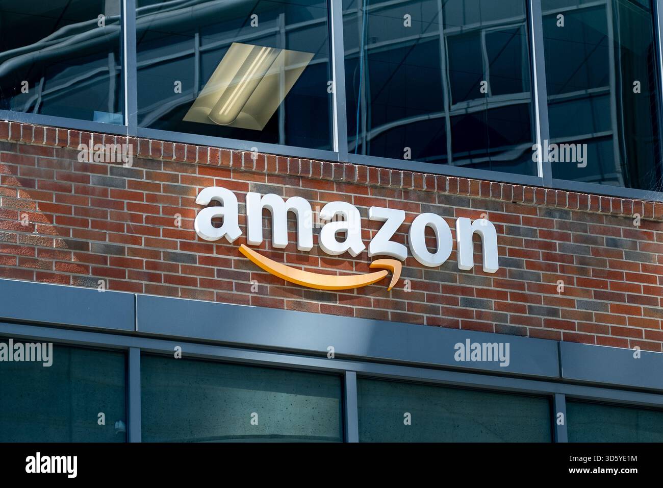 Amazon logo on brick office building facade with windows, San Francisco ...