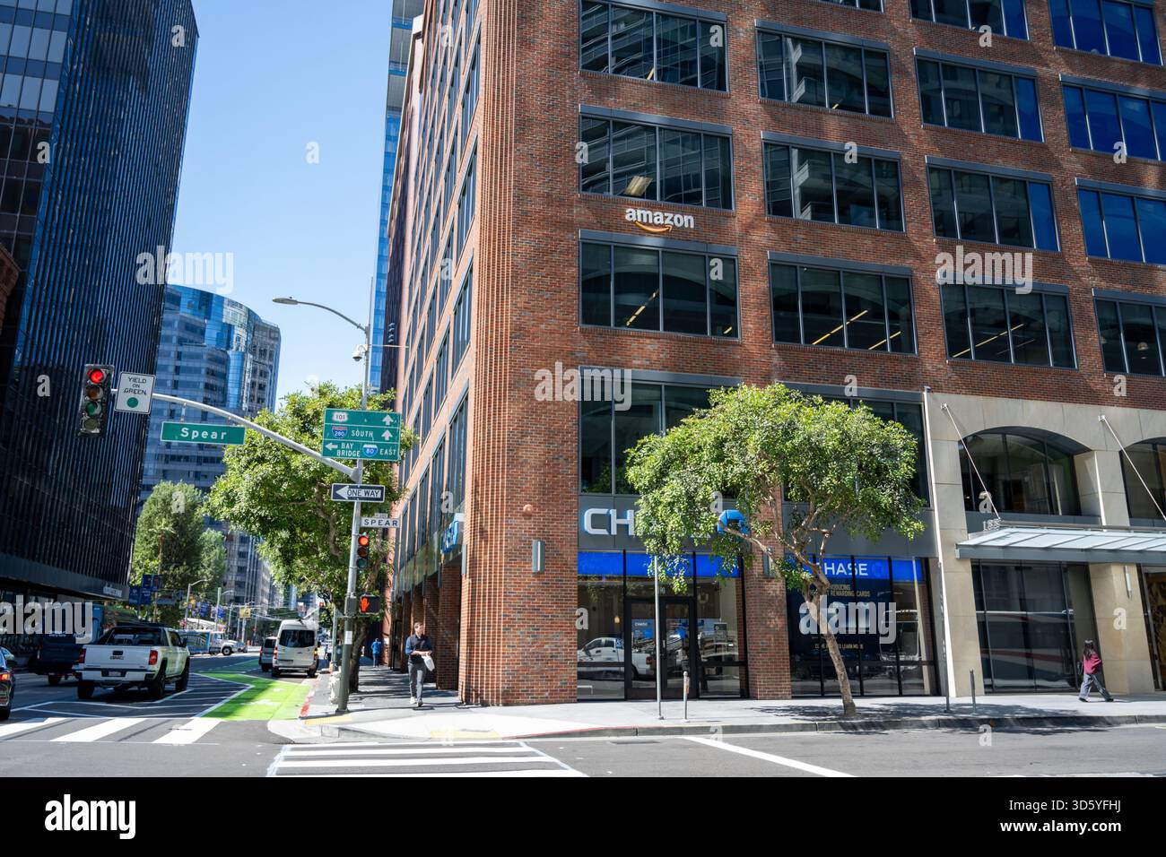 Corner view of brick office building with Amazon logo and a Chase bank ...