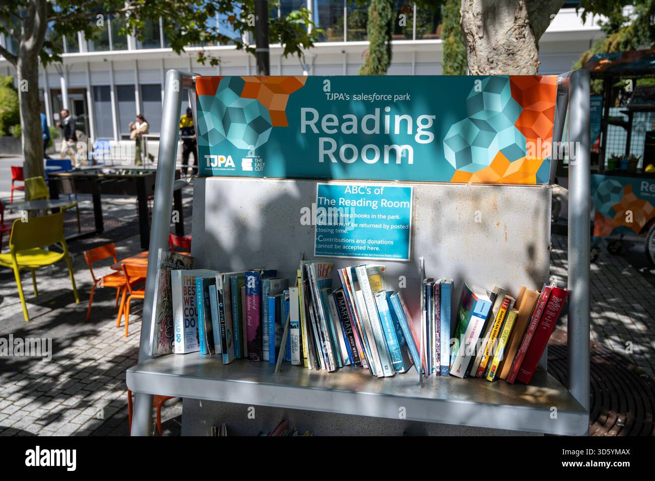 Reading Room free library shelf with books and TJPA signage at ...