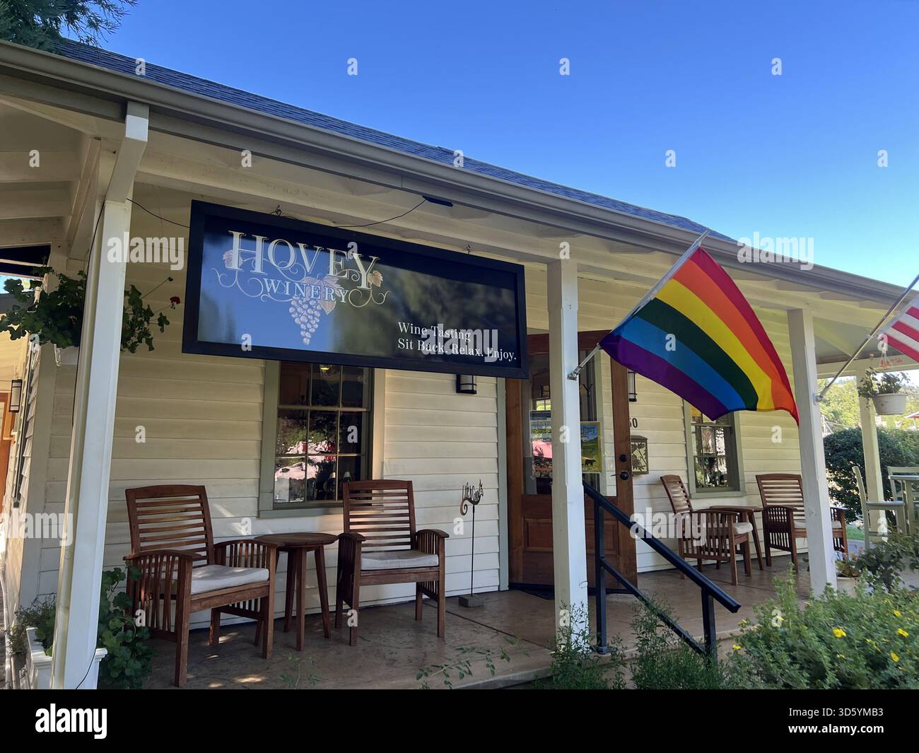 Exterior of Hovey Winery Tasting Room with sign, porch seating, and ...