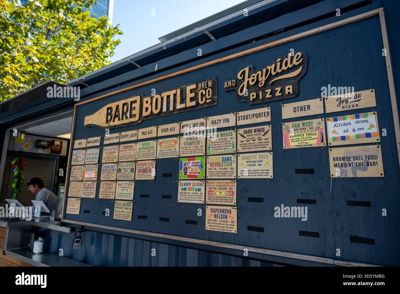 Barebottle Brew Co and Joyride Pizza outdoor kiosk with beer tap list ...
