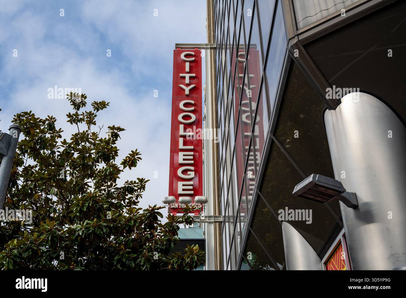 Vertical City College of San Francisco sign on modern glass facade with ...