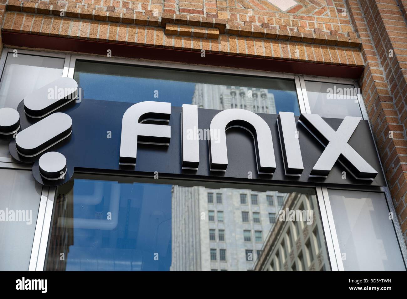 Finix logo signage on office facade with reflections of downtown ...
