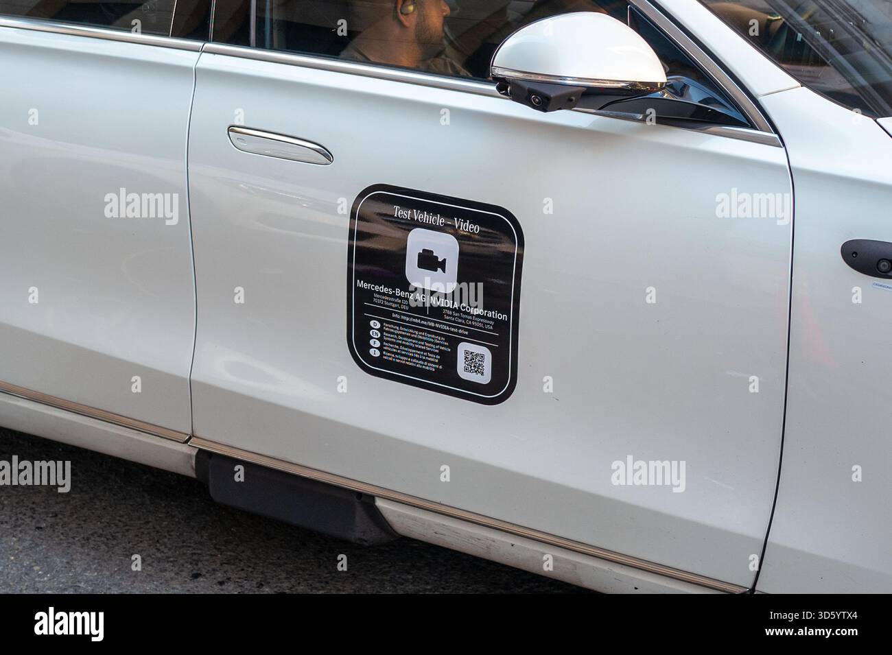 Self-driving car test vehicle with sticker identifying it as part of a ...