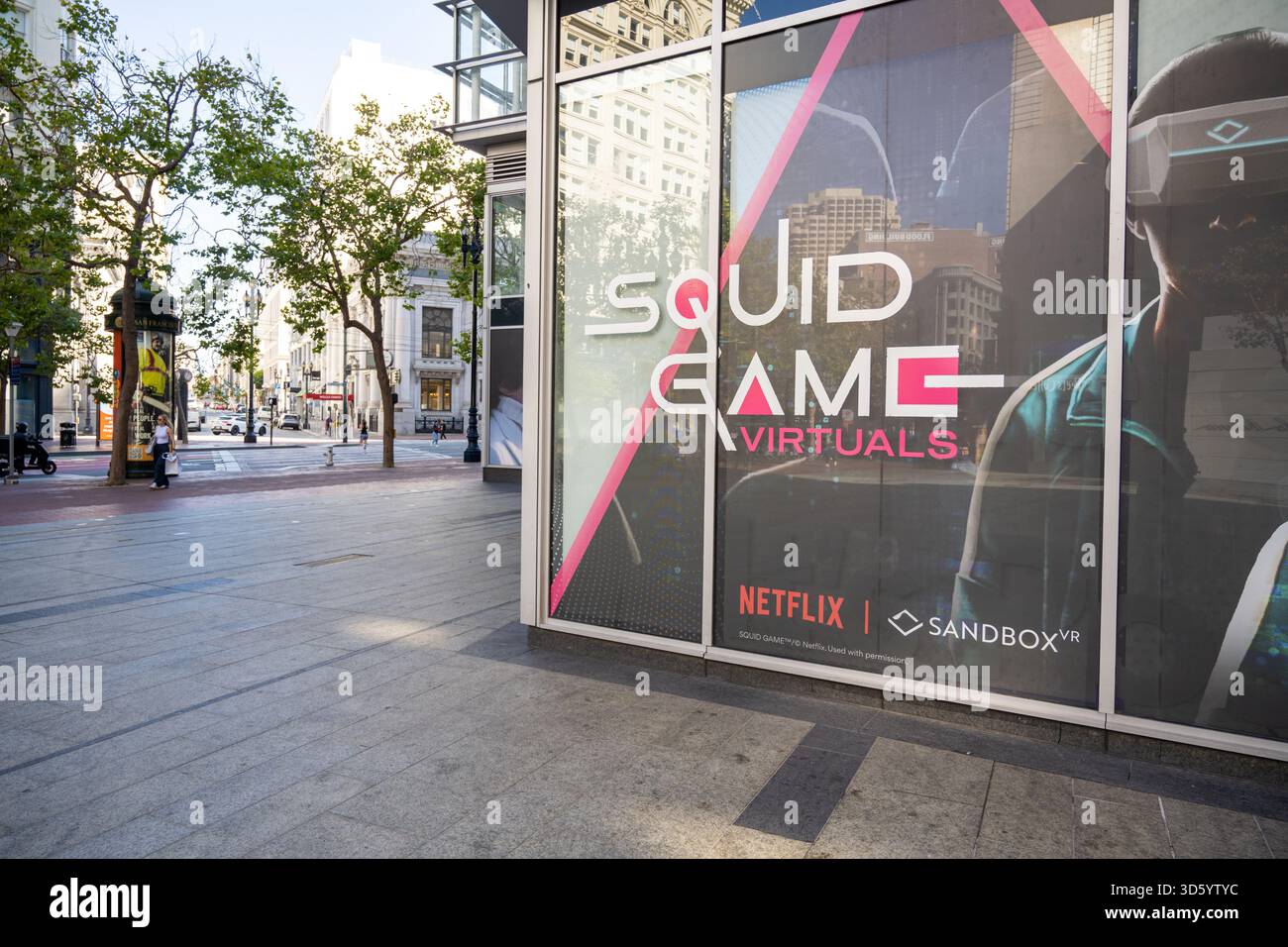 Window display promoting "Squid Game Virtuals" VR experience with ...