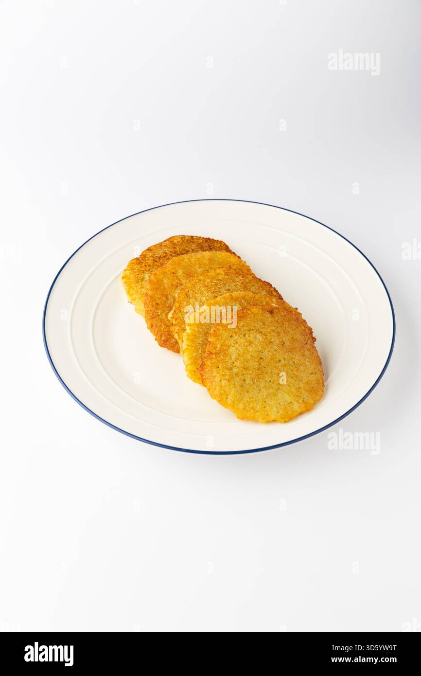 Stack golden potato fritters hi-res stock photography and images - Alamy