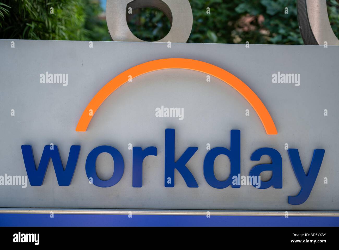 Close-up of Workday logo on exterior sign with orange arc and blue ...