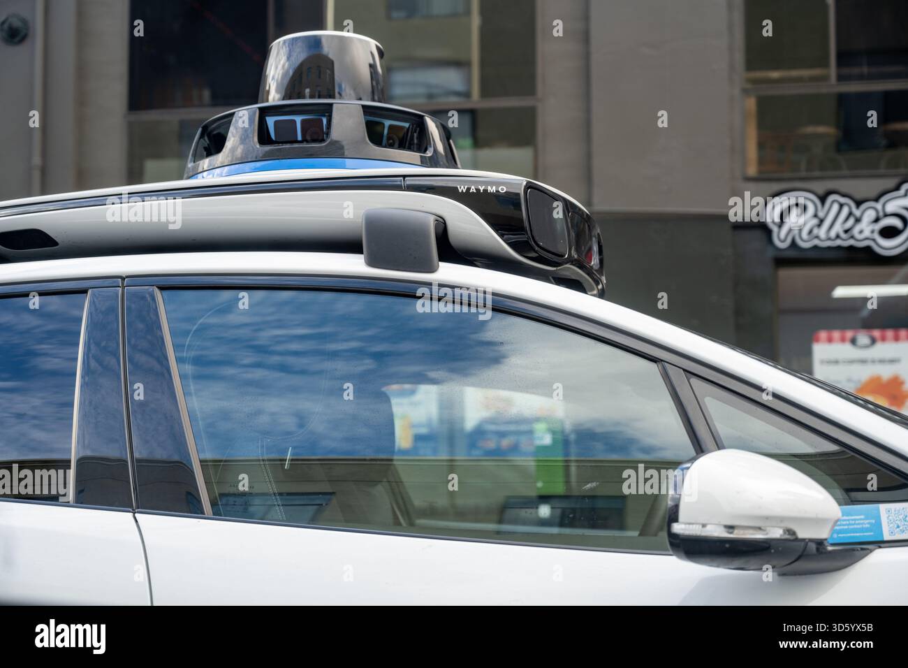 Close-up of roof-mounted lidar and cameras on Waymo autonomous vehicle ...