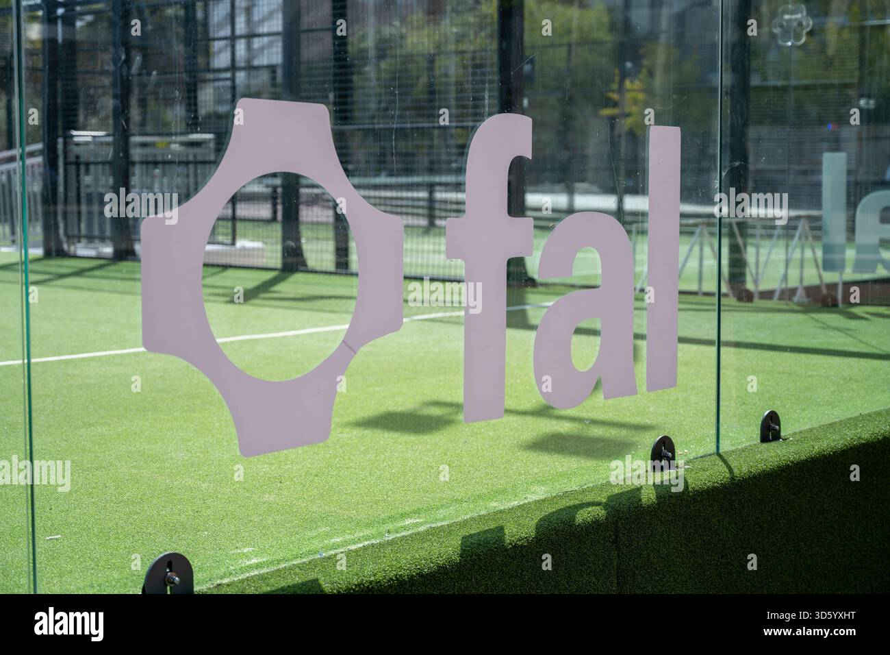 Logo for artificial intelligence company Fal on a padel court in San ...