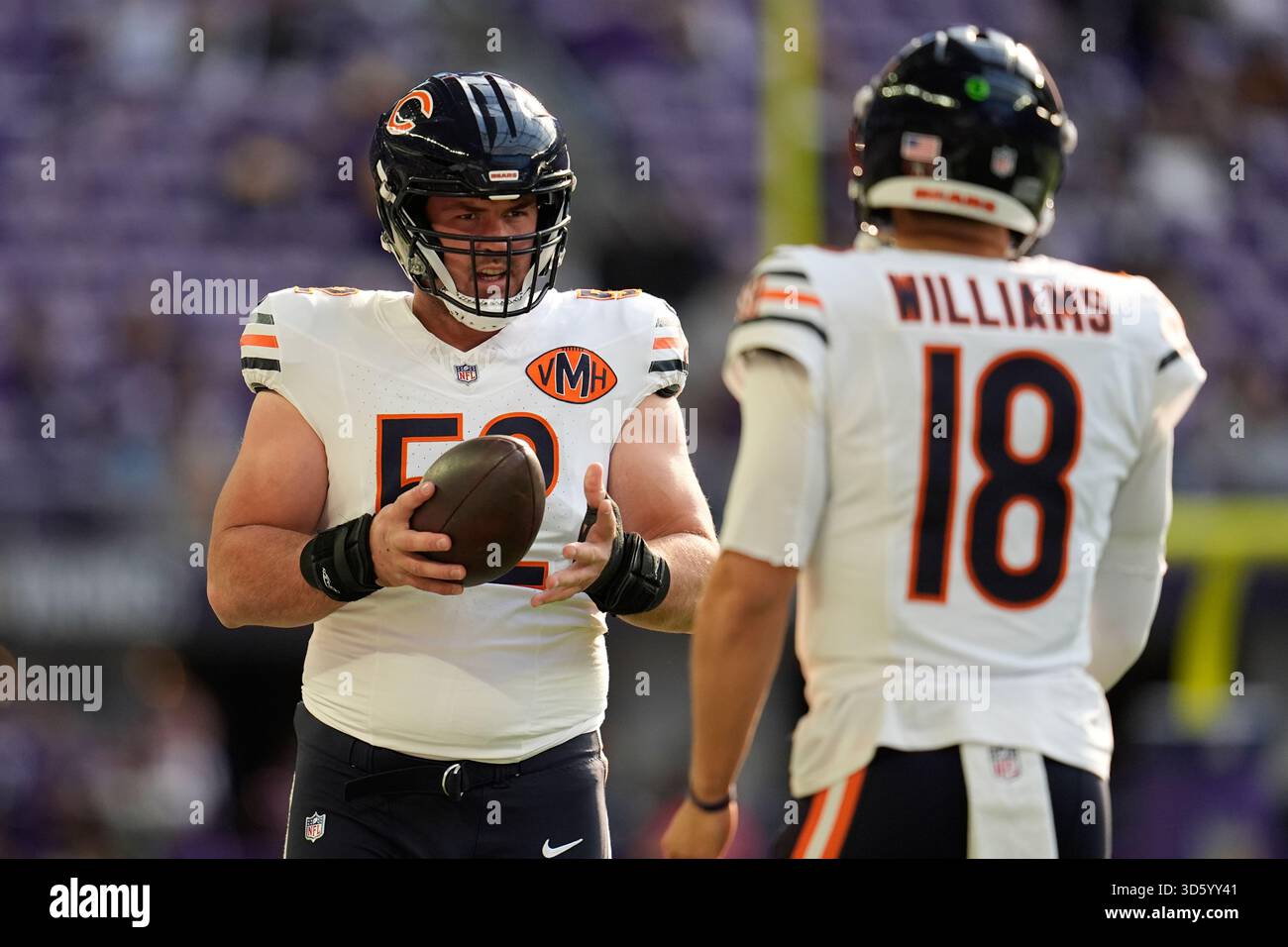 Chicago Bears center Drew Dalman (52) and quarterback Caleb Williams ...