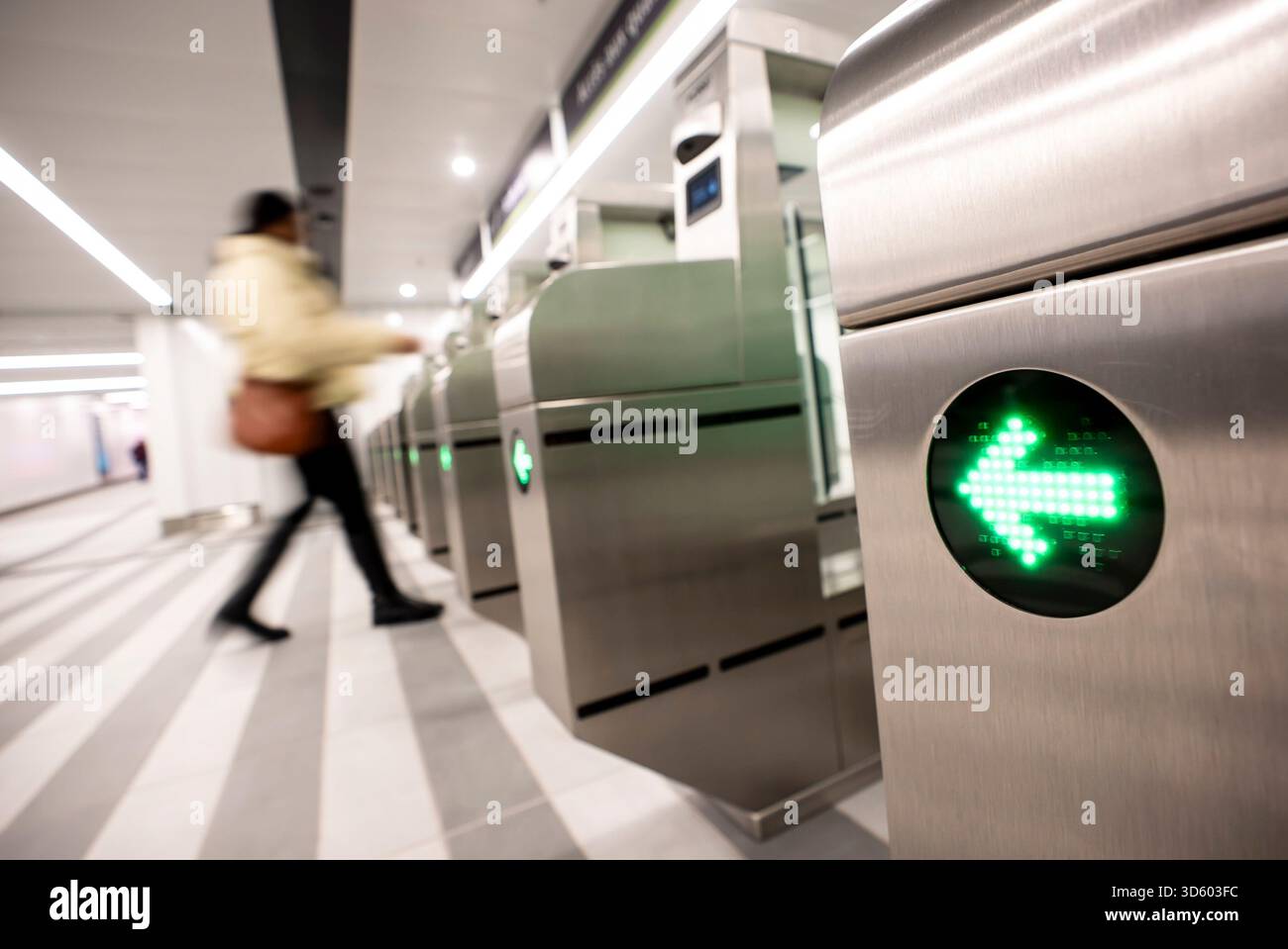 A person enters the REM light rail system at McGill station, in ...