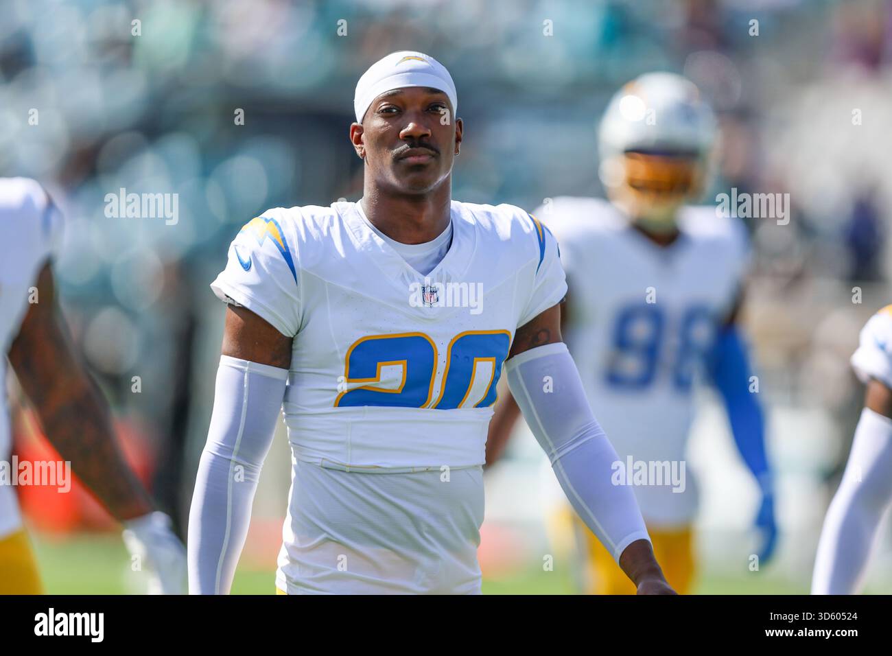 Los Angeles Chargers cornerback Cam Hart (20) walks the sideline before ...