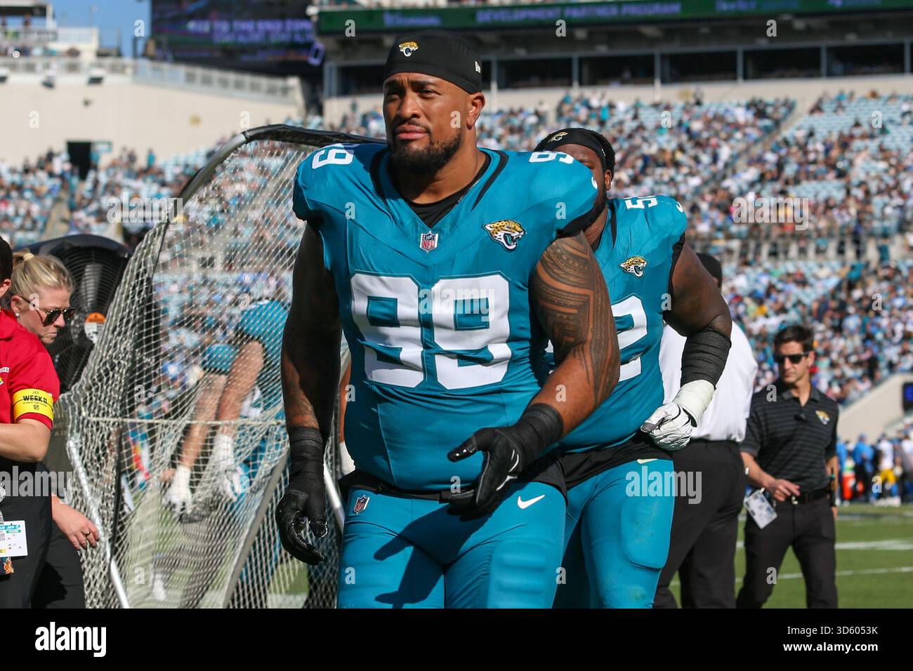 Jacksonville Jaguars defensive tackle Austin Johnson (99) leaves the ...