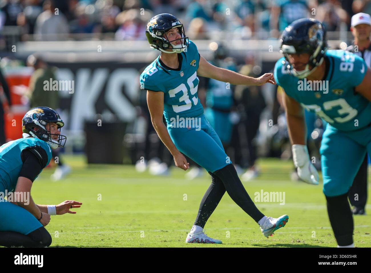 Jacksonville Jaguars place kicker Cam Little (39) kicks an extra point ...