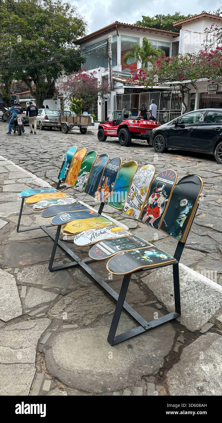 A custom street bench made from multiple recycled skateboards and a ...
